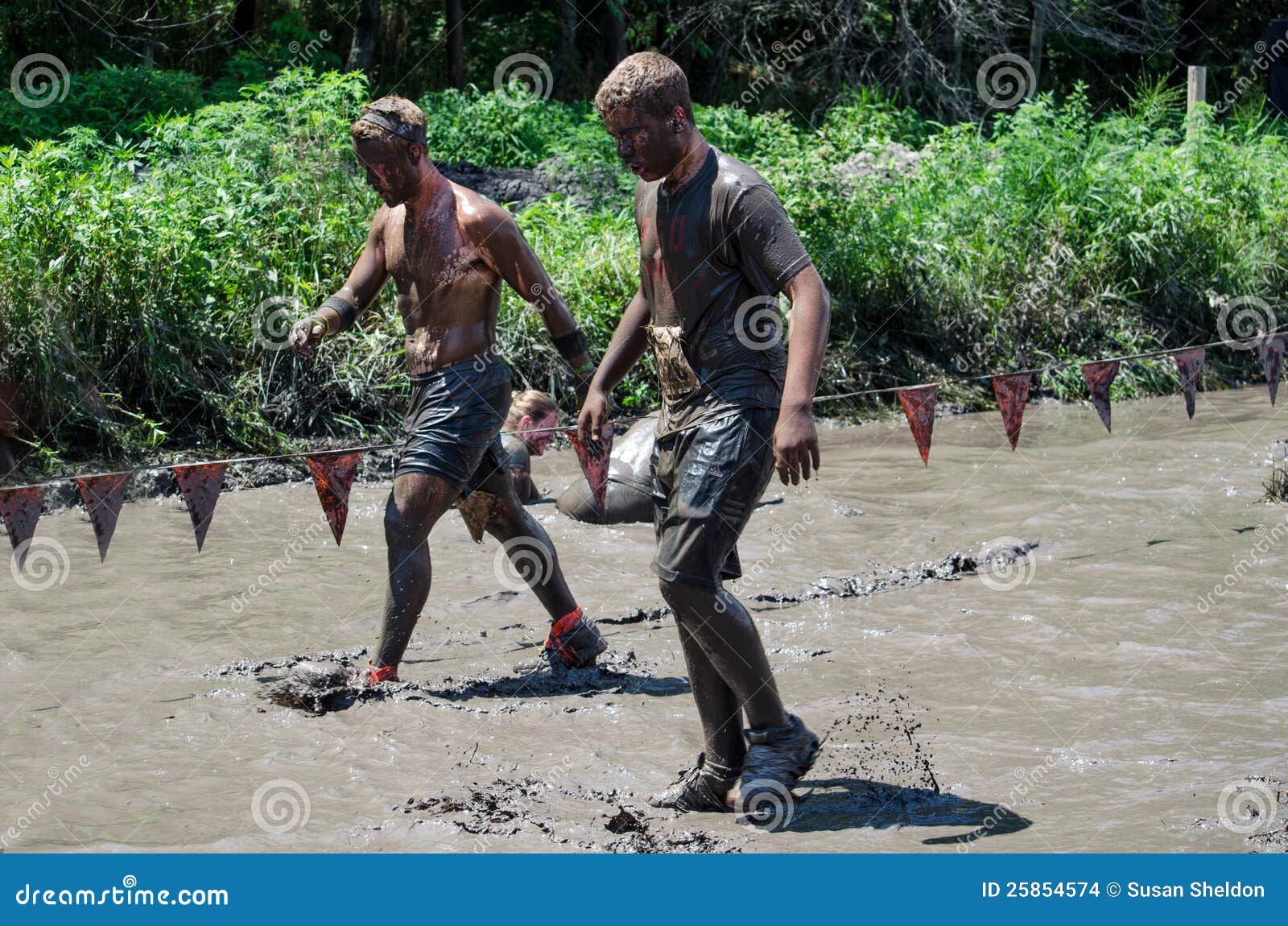 Slow going mud editorial stock image. Image of teens - 25854574