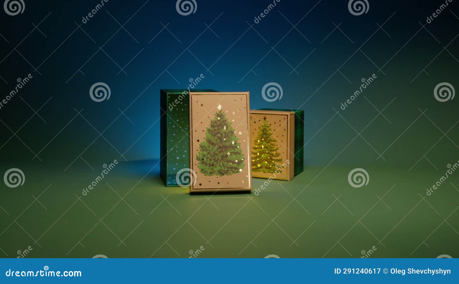 Two Gift Boxes with Christmas Tree on Top Cinematically Shining Light ...