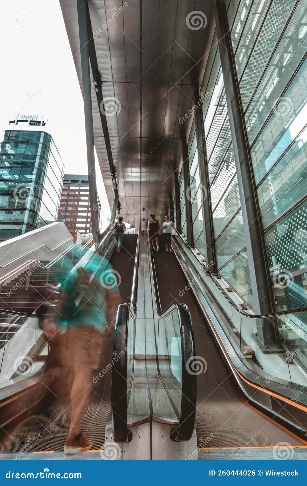 Slow Motion of Man Walking Up Escalators in City Stock Photo - Image of ...
