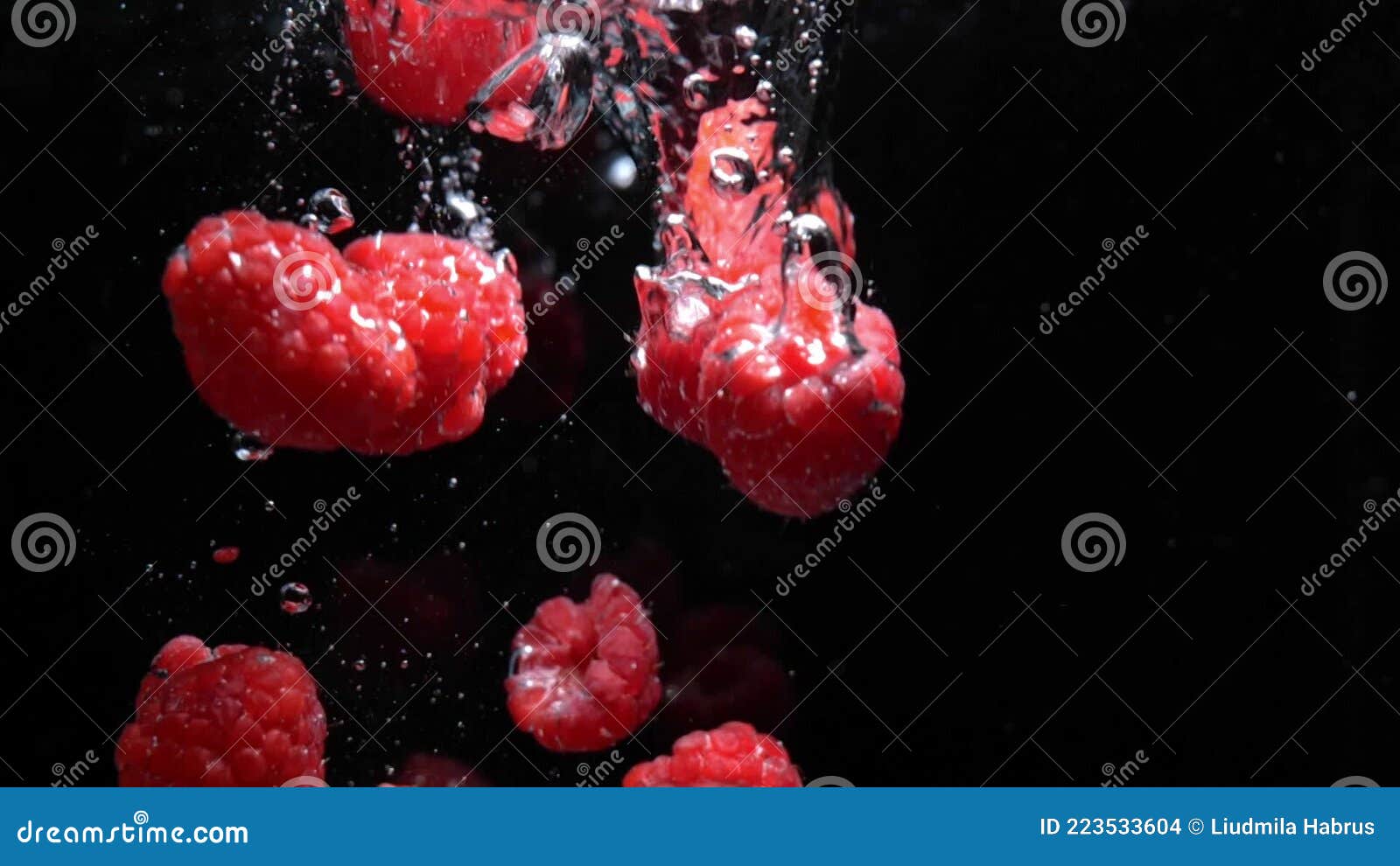 Slow Motion Raspberry Falling into Water on Black Background Stock ...