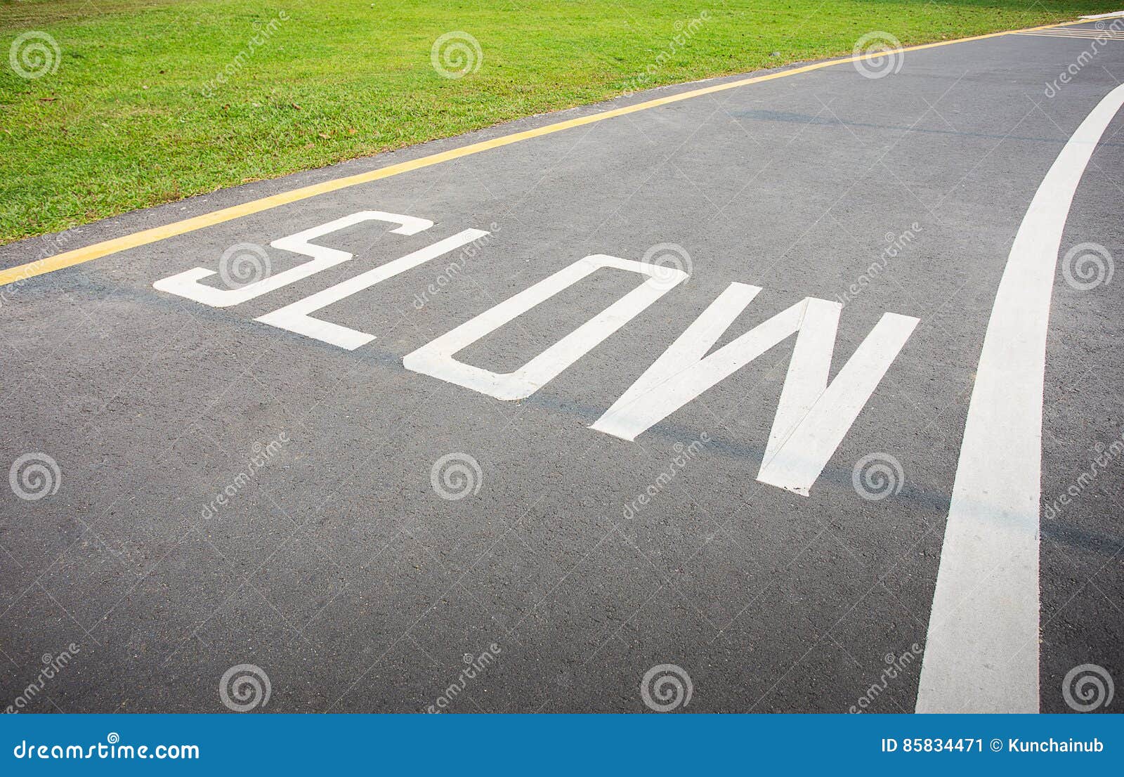 Slow Sign Painted on the Road Stock Image - Image of safety ...