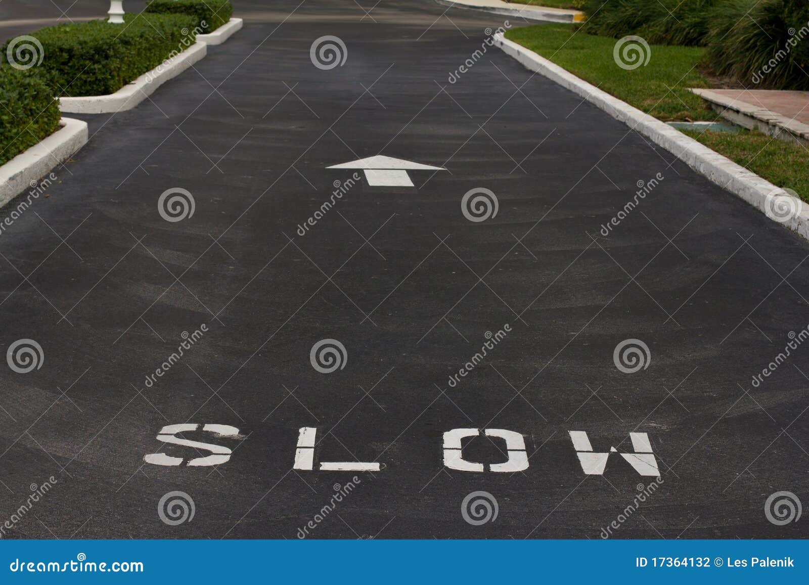 Slow sign on the road stock photo. Image of white, surface - 17364132