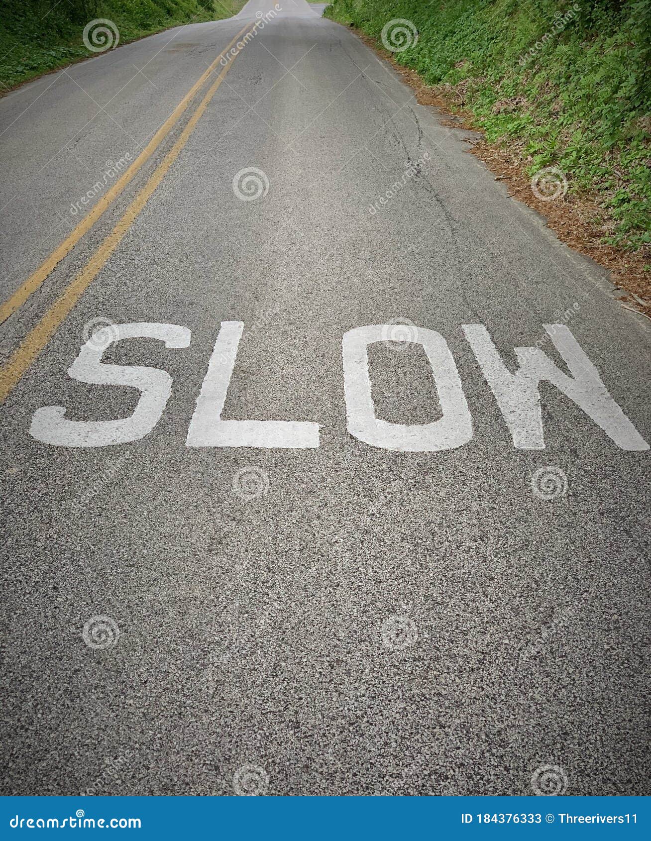 Slow sign on road stock image. Image of asphalt, sign - 184376333
