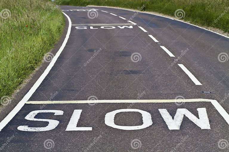 Slow signs on the road stock photo. Image of lines, gray - 25378206