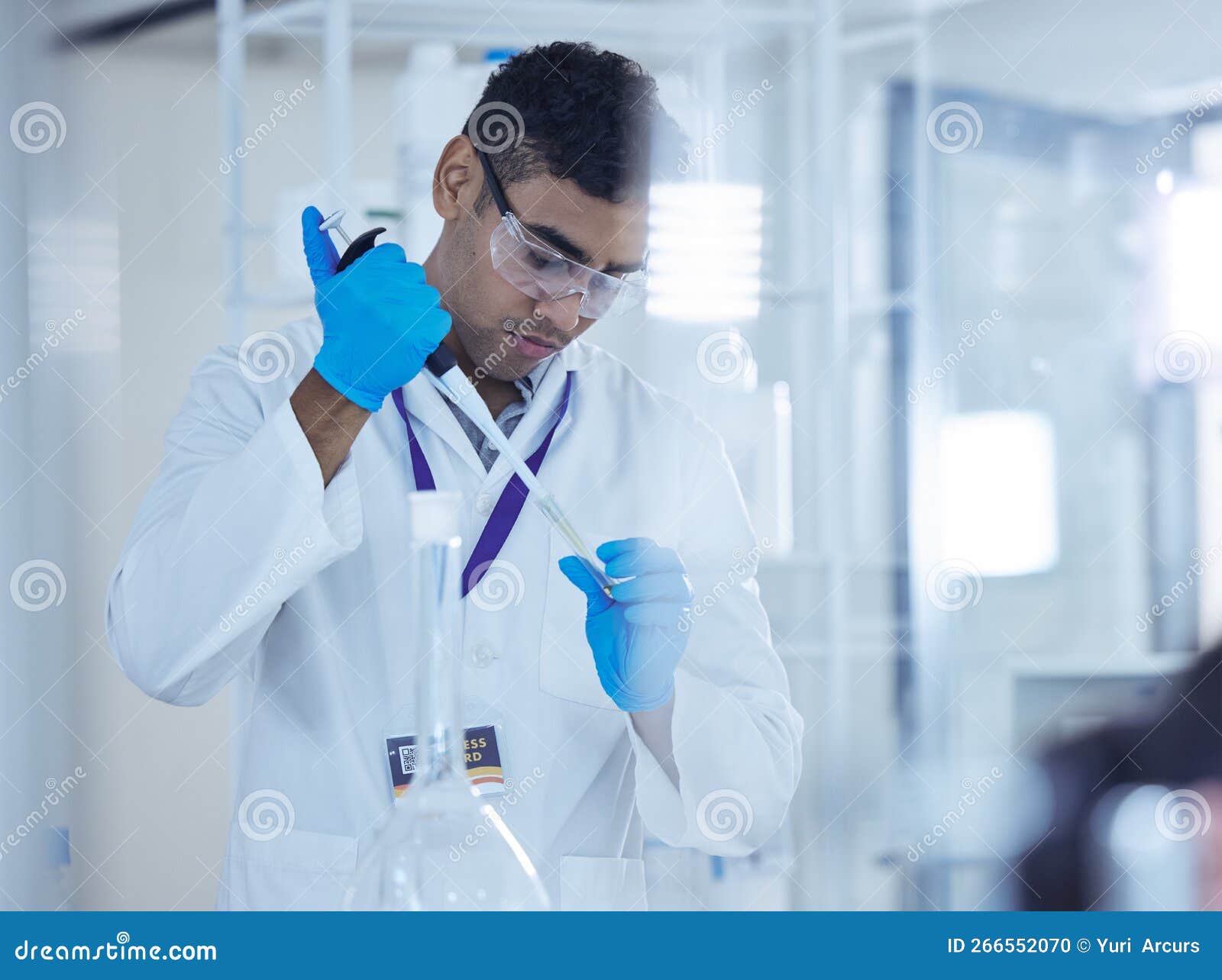 Slow and Steady. a Male Scientist Decanting Samples into Test Tubes ...