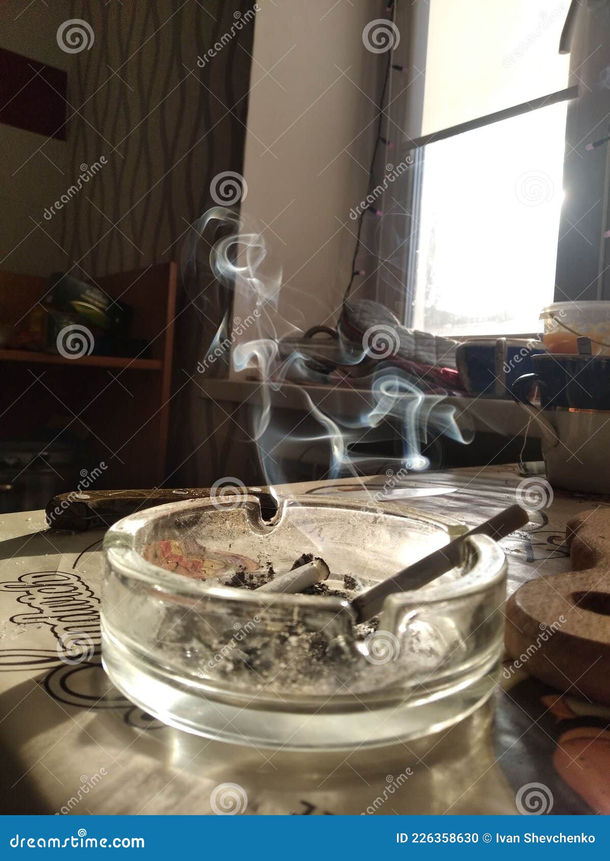 Slowly Smoldering Cigarette Emitting Beautiful White Smoke Stock Photo ...