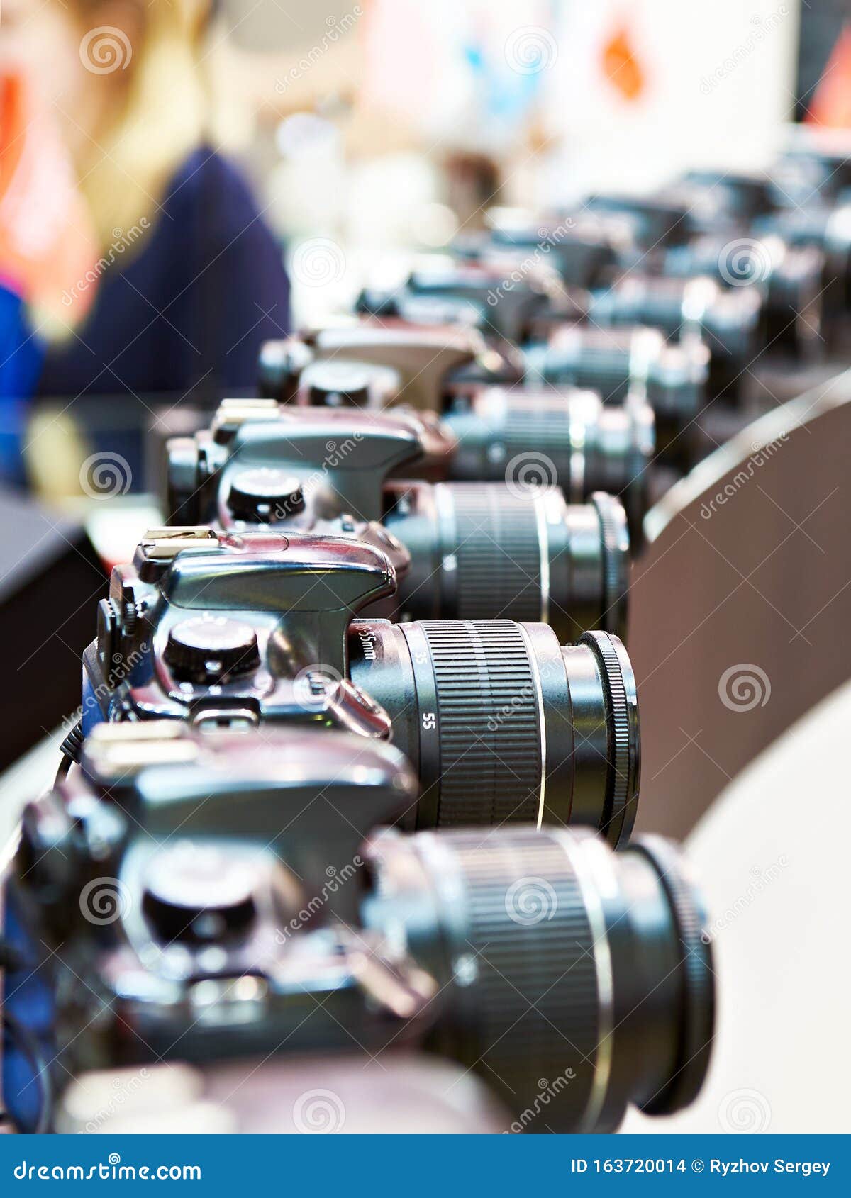 SLR digital cameras in row stock photo. Image of close - 163720014