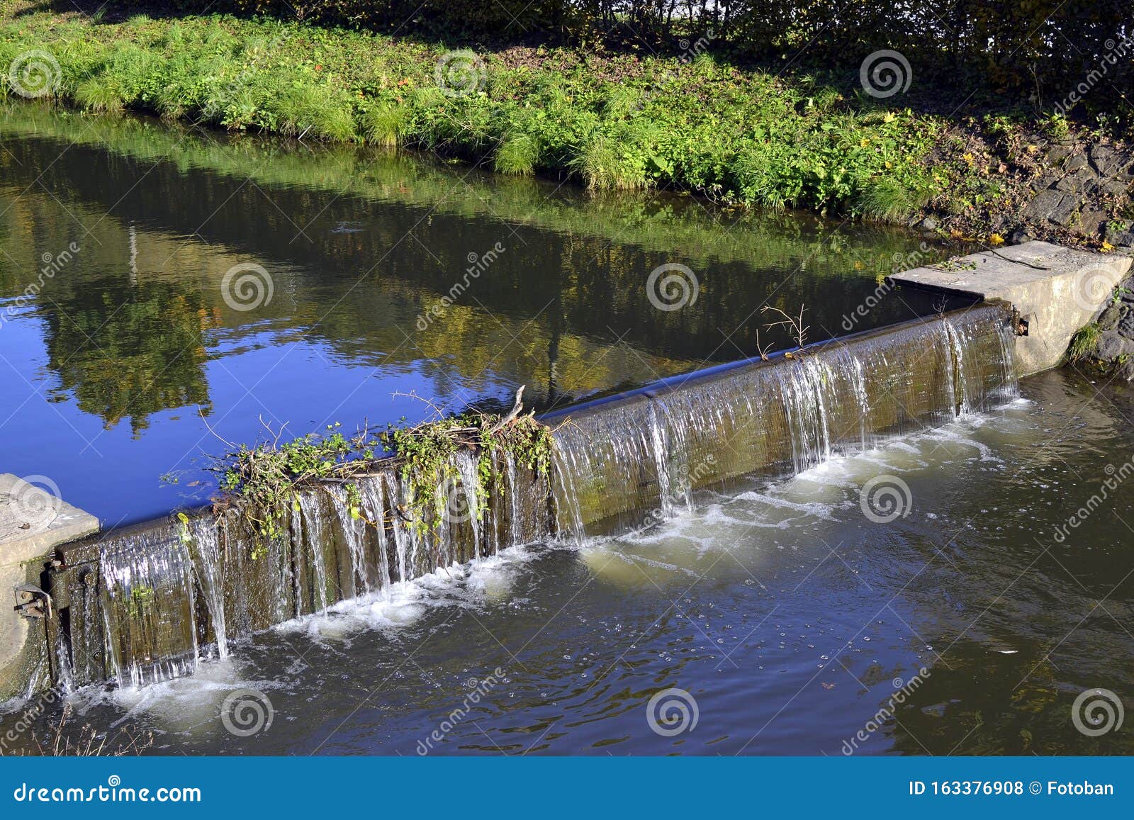 Sluice on a small river stock photo. Image of sluice - 163376908