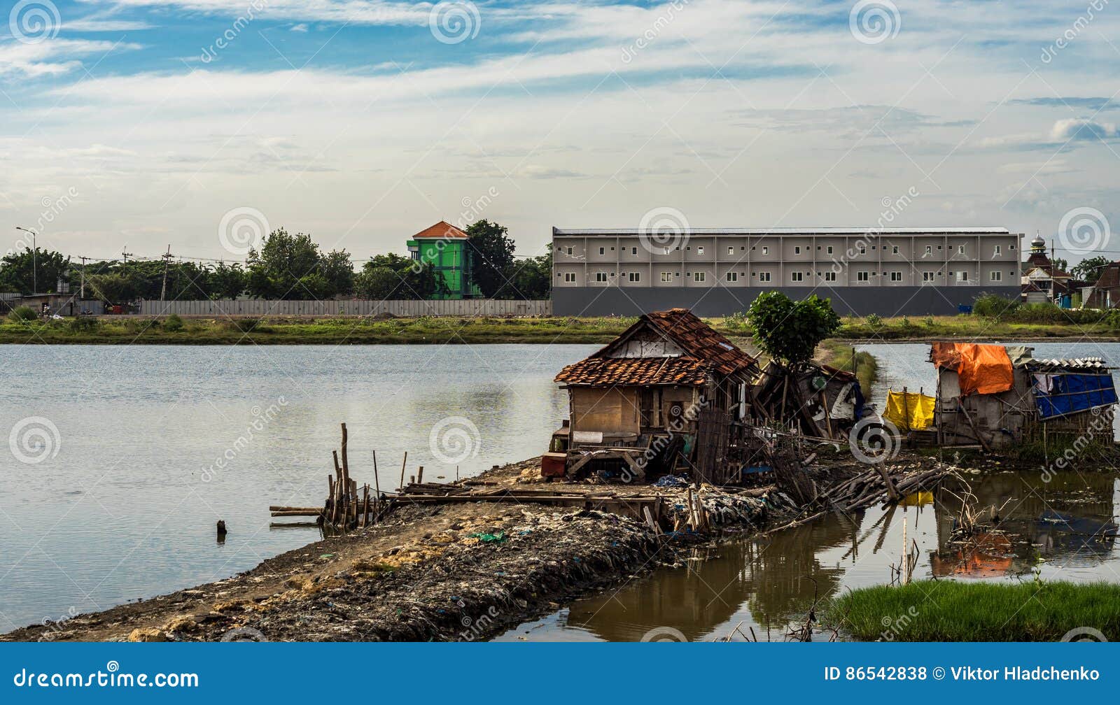 A slum on the lake stock photo. Image of pakistan, landscape - 86542838