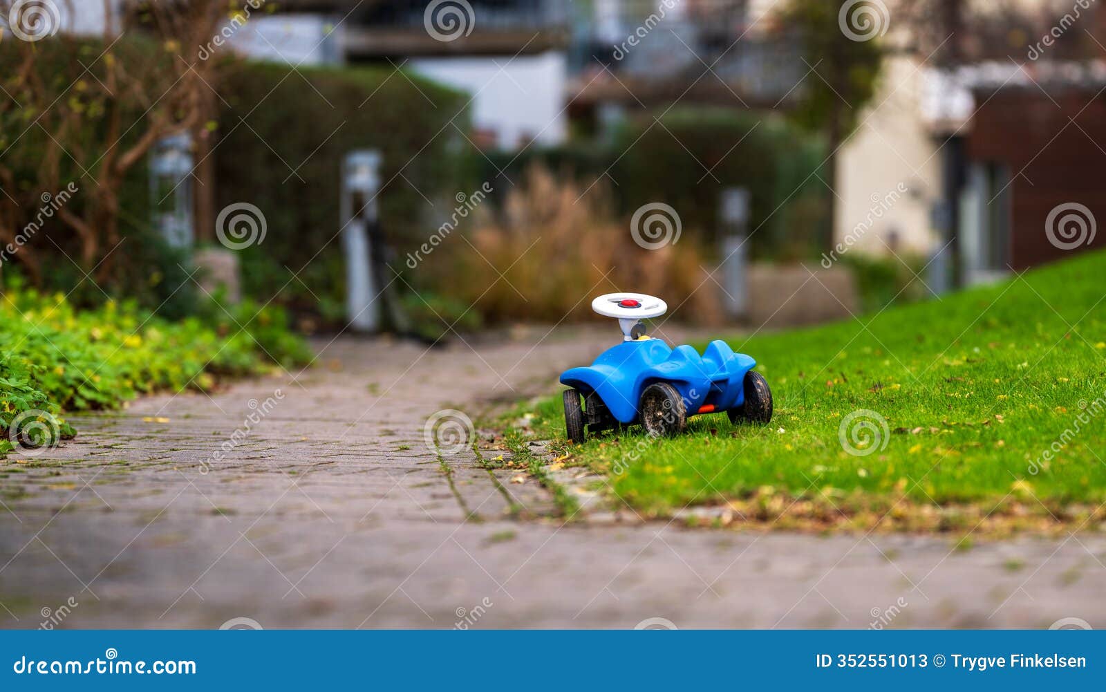 Small Abandoned Blue Bobby Car on the Grass.. Stock Image - Image of ...