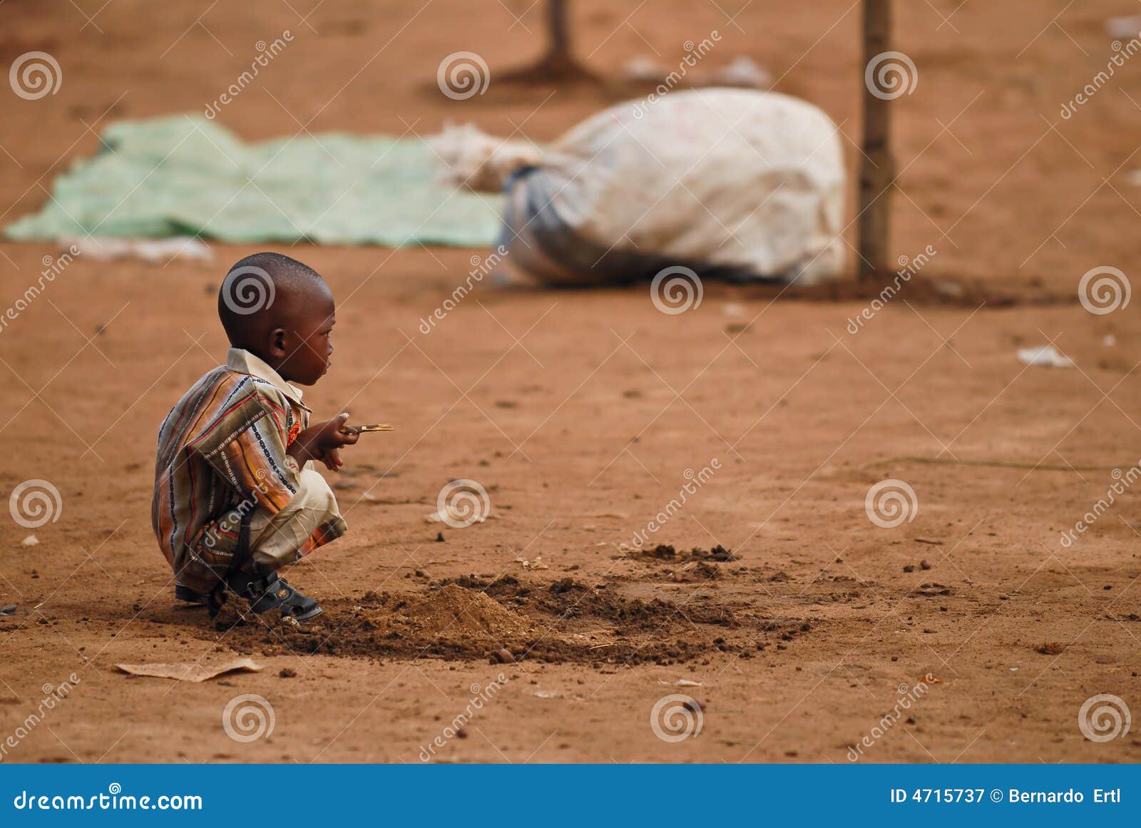 Small African Boy In White Shirts Choosing Clothes Stock Image ...