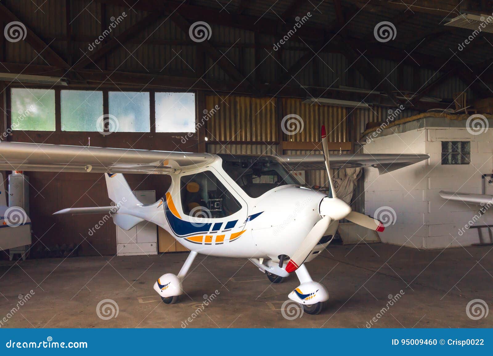 Small aircraft in a hangar stock photo. Image of historic - 95009460