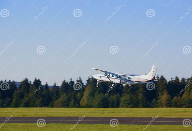 Small airplane lifting off stock image. Image of plane - 21626873