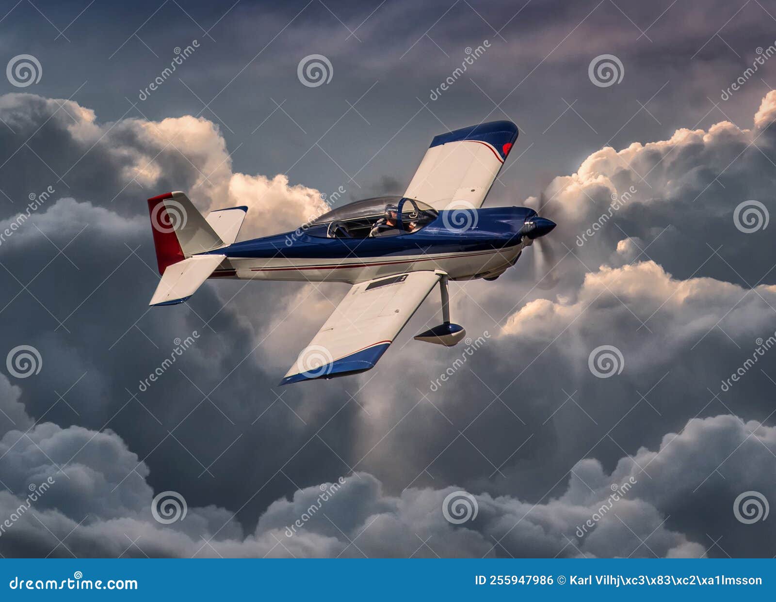 A Small Airplane in the Sky Against Dramatic Clouds Editorial Photo ...