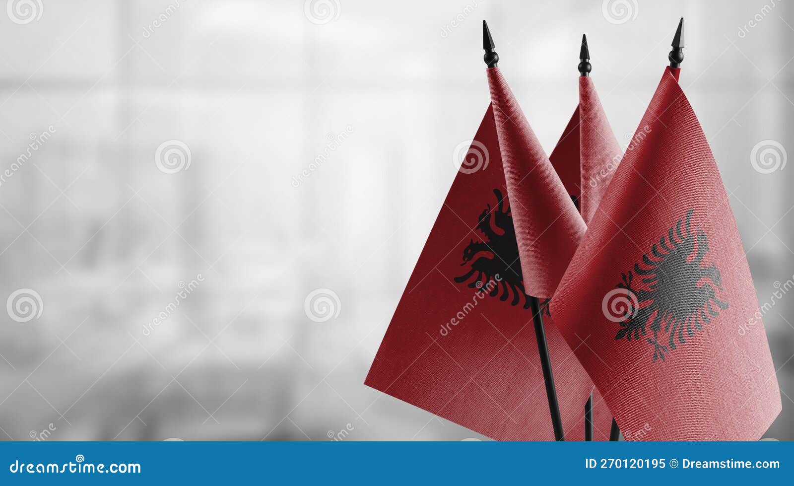 A Small Albania Flag on an Abstract Blurry Background Stock Image ...