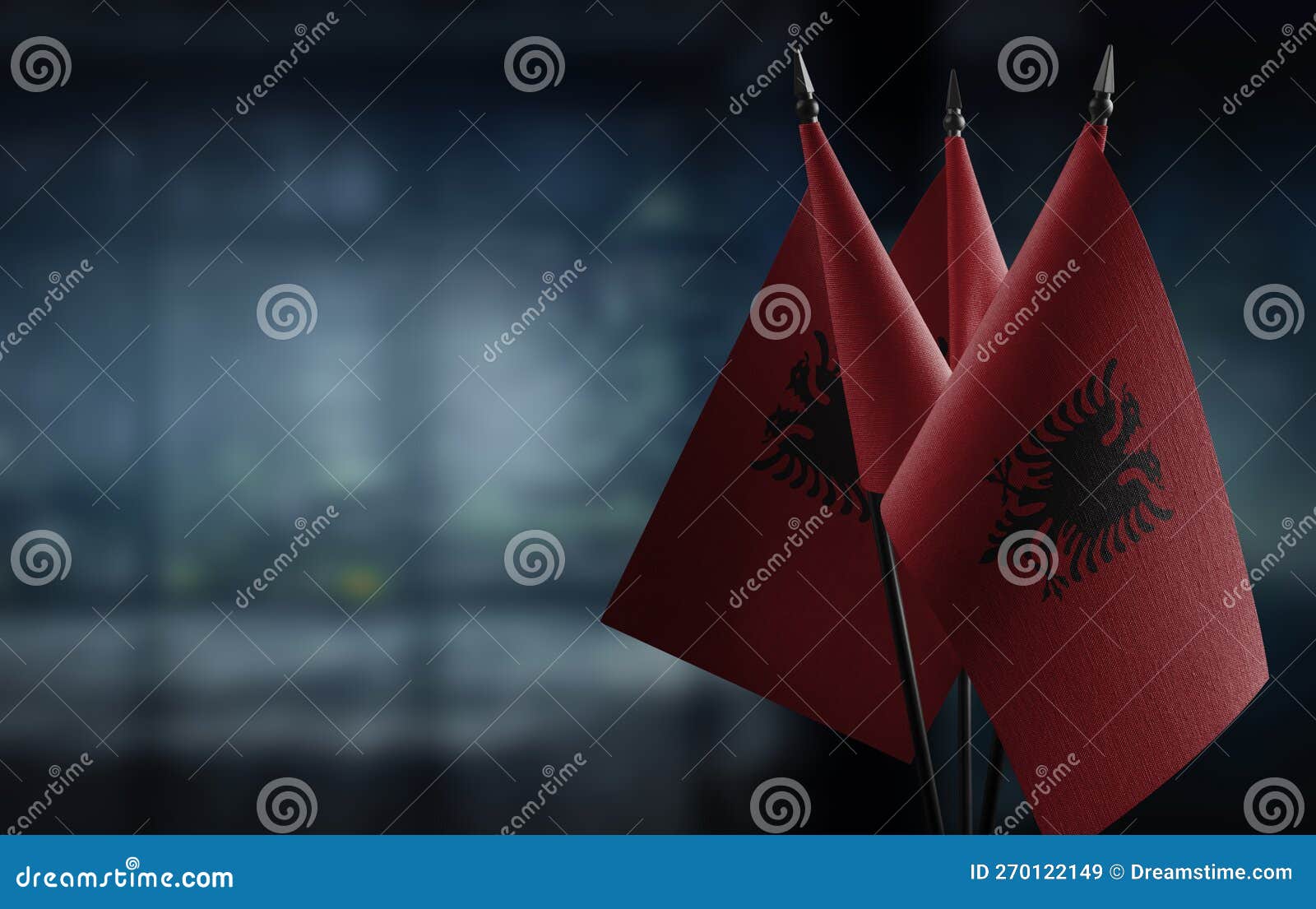 A Small Albania Flag on an Abstract Blurry Background Stock Image ...