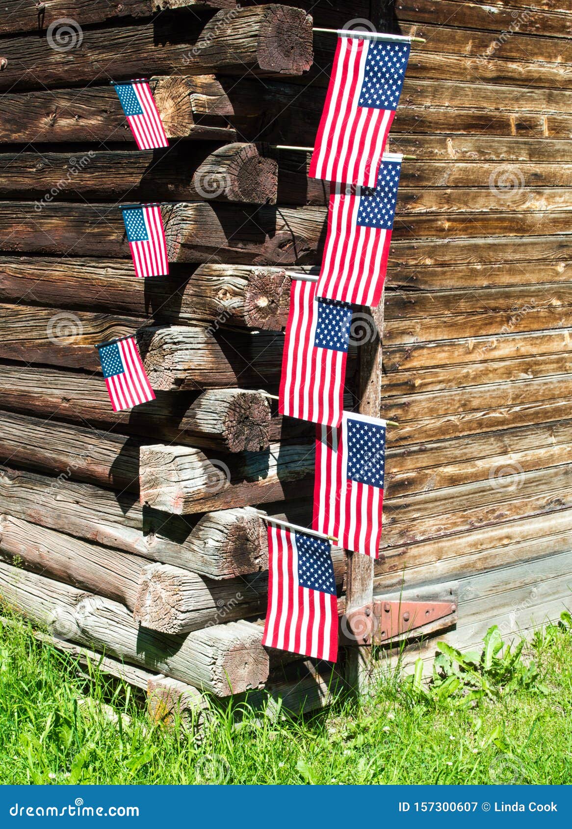 Small American Flags on the Corner of a Rustic Log Barn Stock Image ...