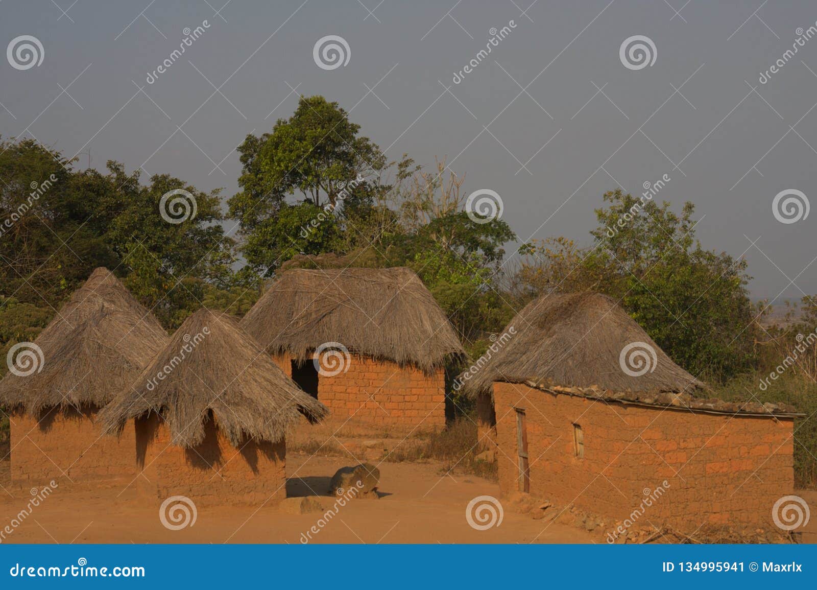 Small Angolan Village with Adobe Housing and Straw Roofs Stock Image ...