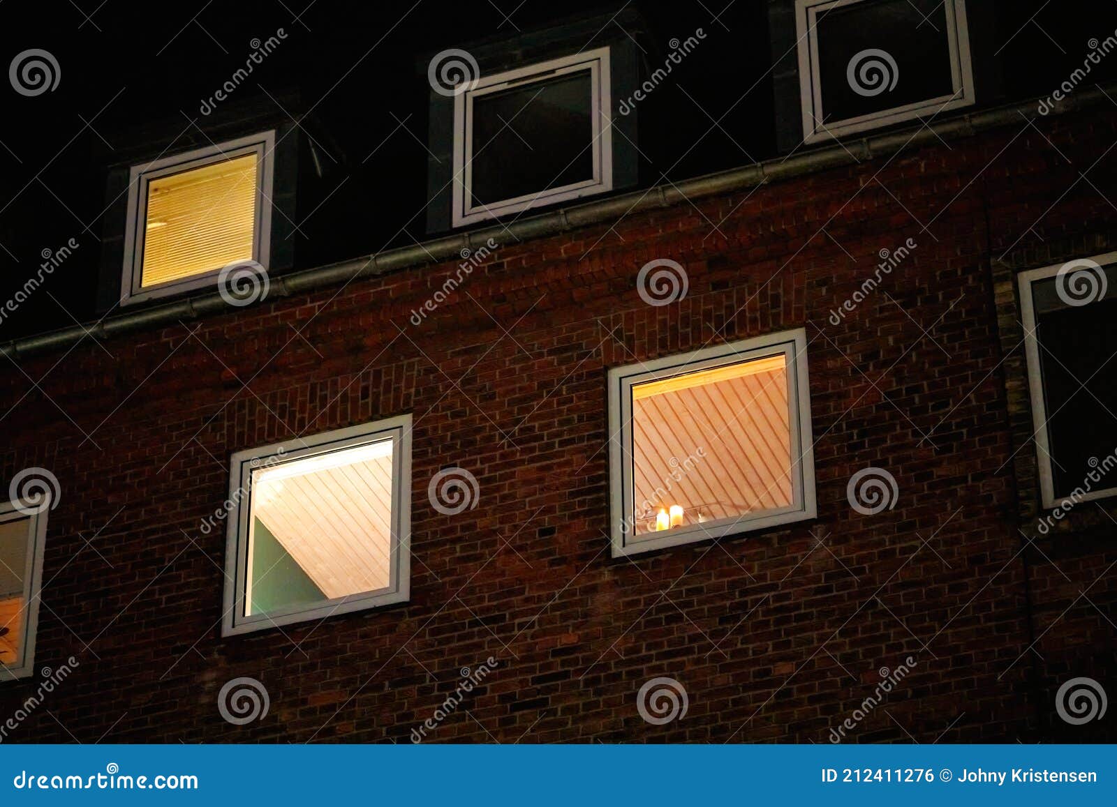 Small Apartment Windows with Lights on at Night Stock Photo - Image of ...
