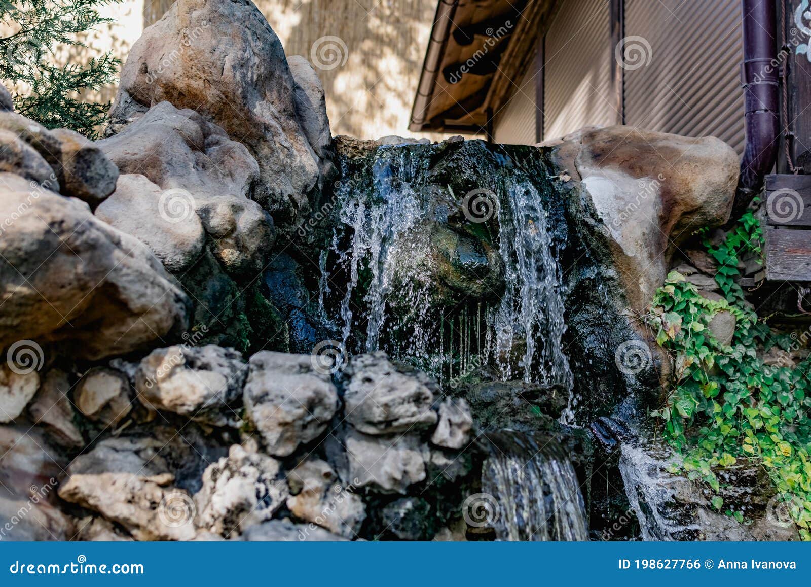 A Small Artificial Freshwater Waterfall that Flows into a Common Living ...