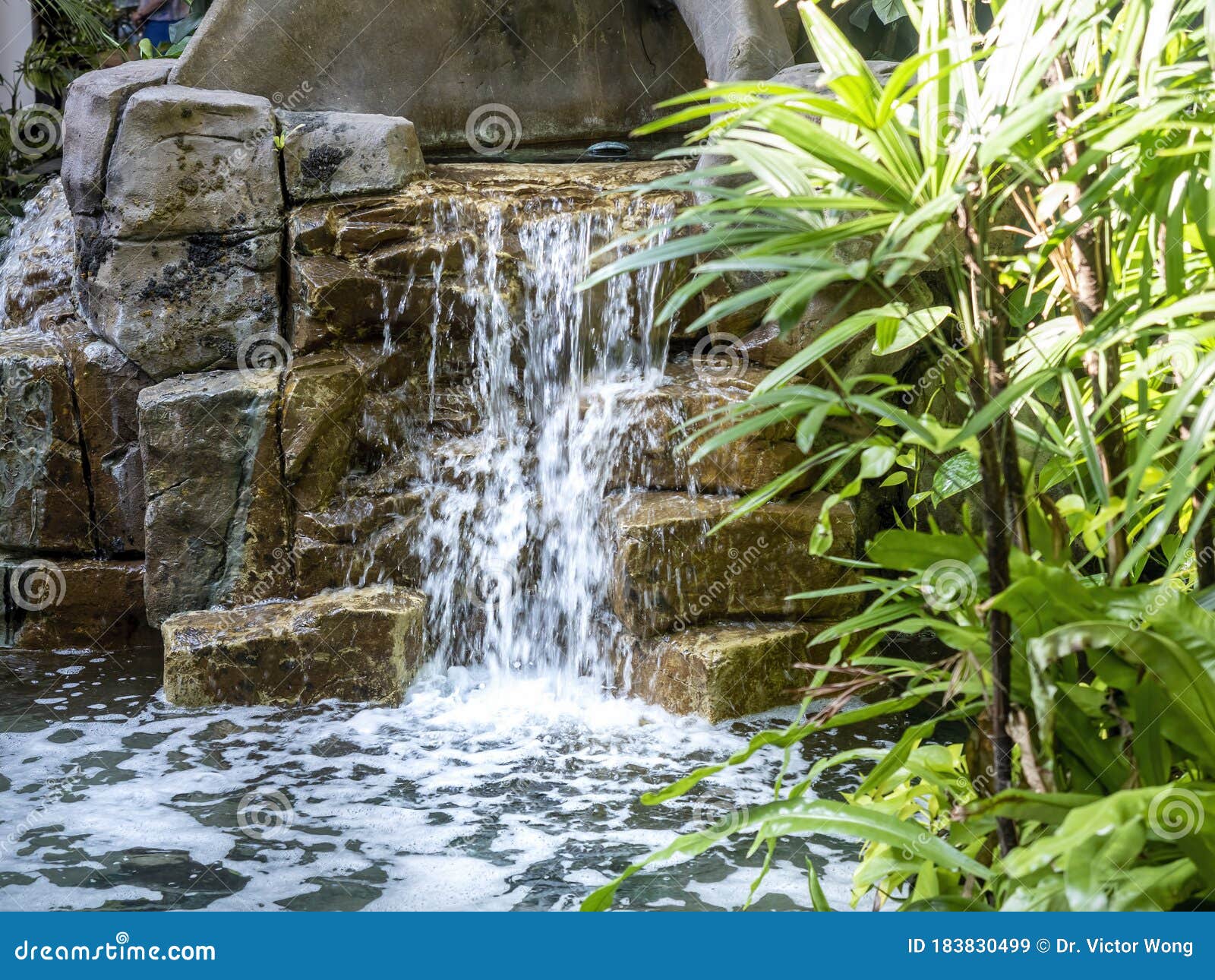 A Small Artificial Waterfall Feature in a Modern Luxury Home Setting ...