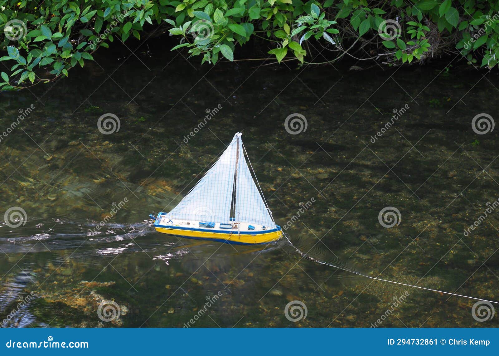 A Small Attractive Model Sailing Boat on a String Floating in a Stream ...