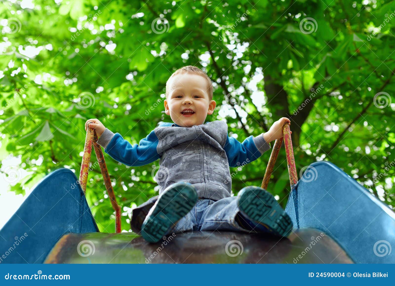 Small Baby Boy Having Fun on Slide in Spring Park Stock Photo - Image ...