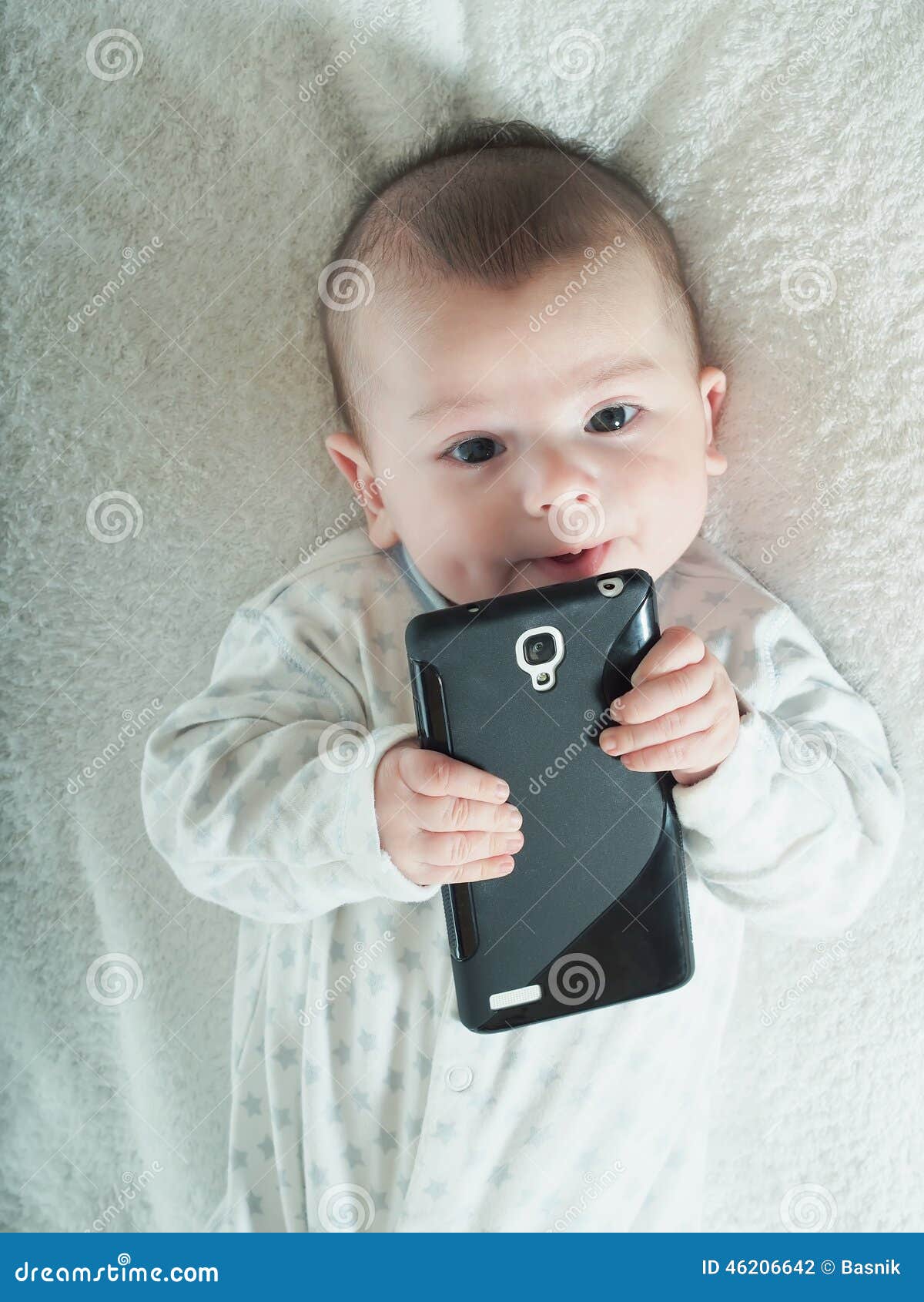 Small Baby Boy Holding Smartphone in Bed Stock Photo - Image of black ...