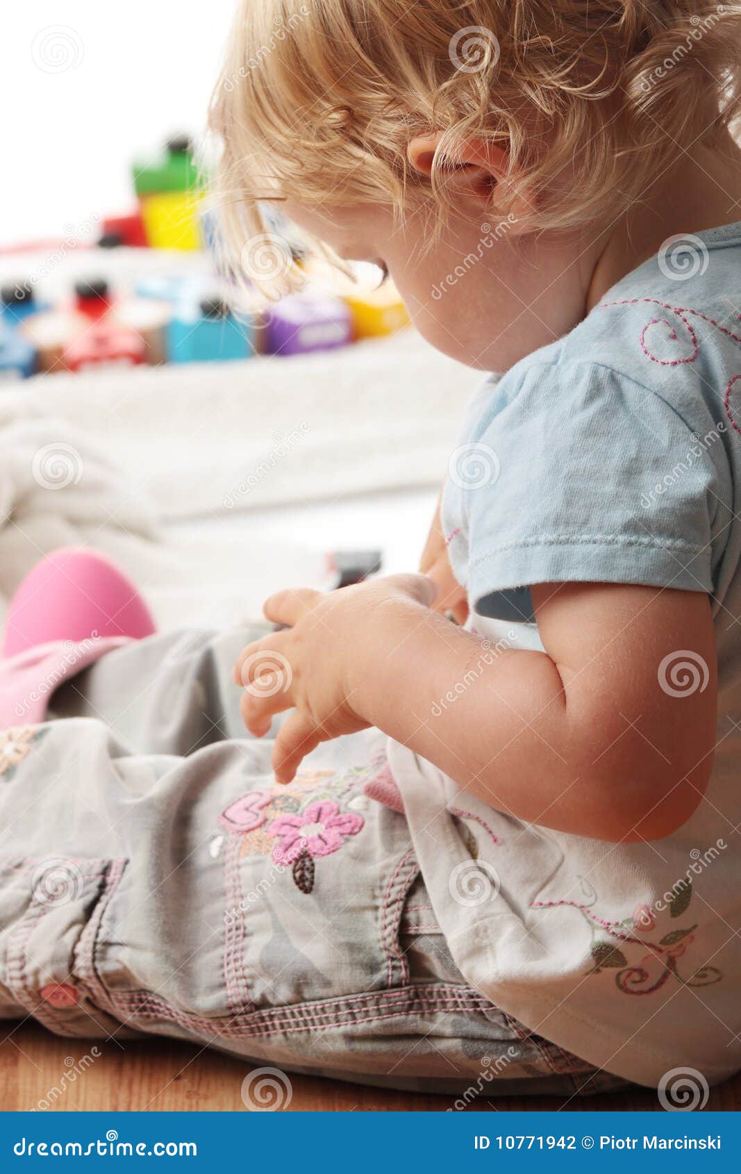 Small baby with a toy stock photo. Image of game, alone - 10771942