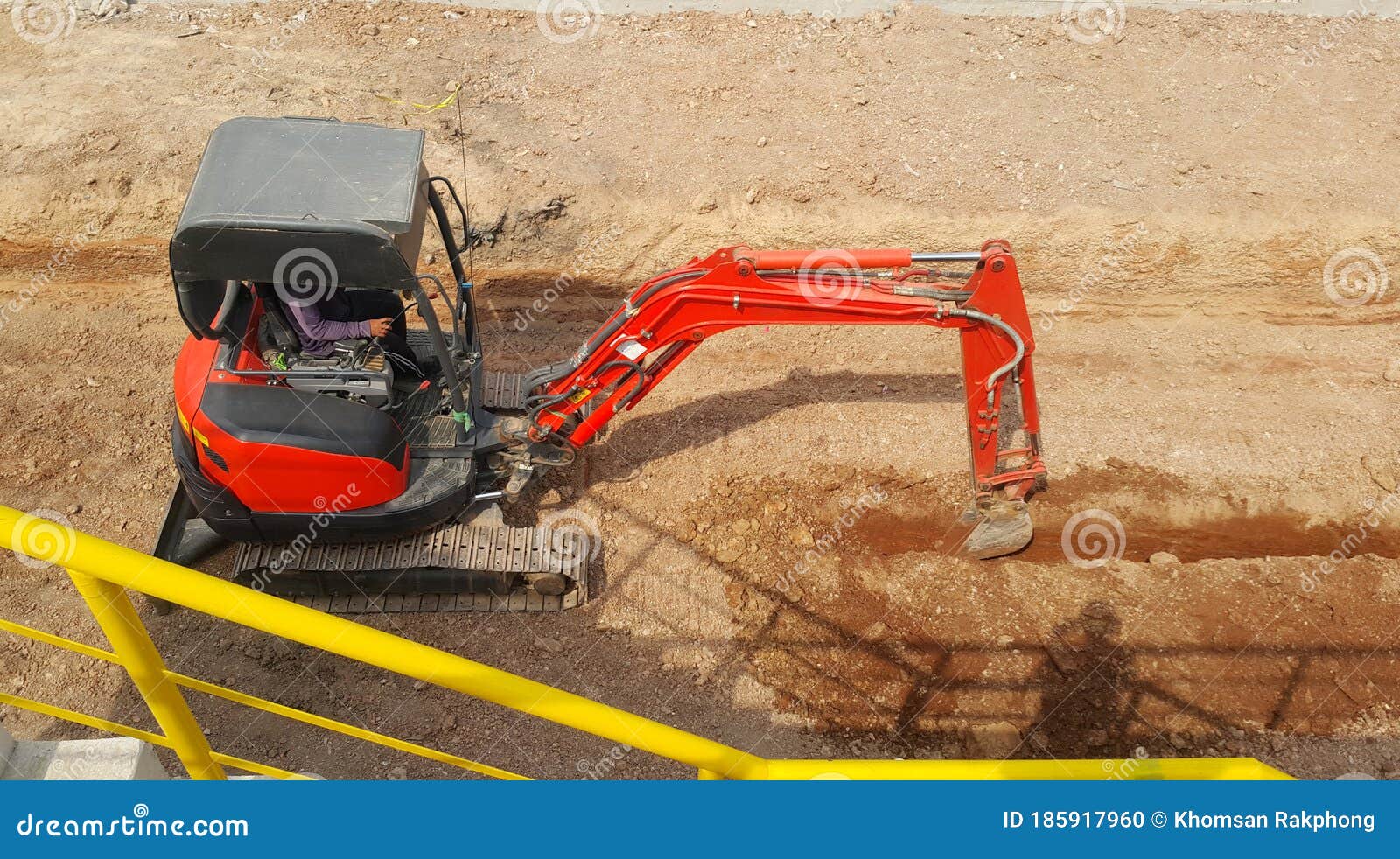 Small Backhoe Is Working Digging Down The Ground Stock Photography ...