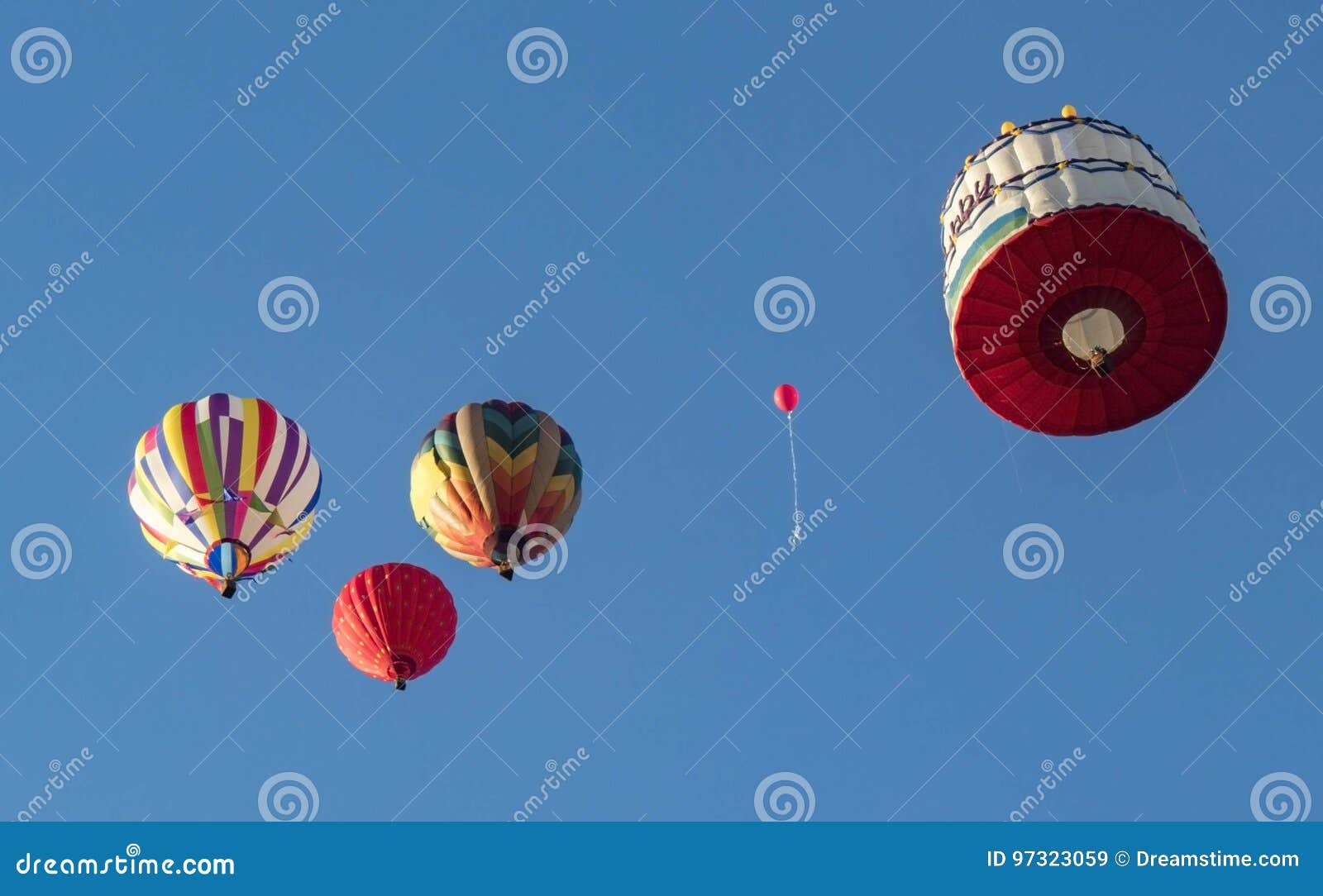 Small Balloon with Large Hot Air Balloons Stock Image - Image of blue ...