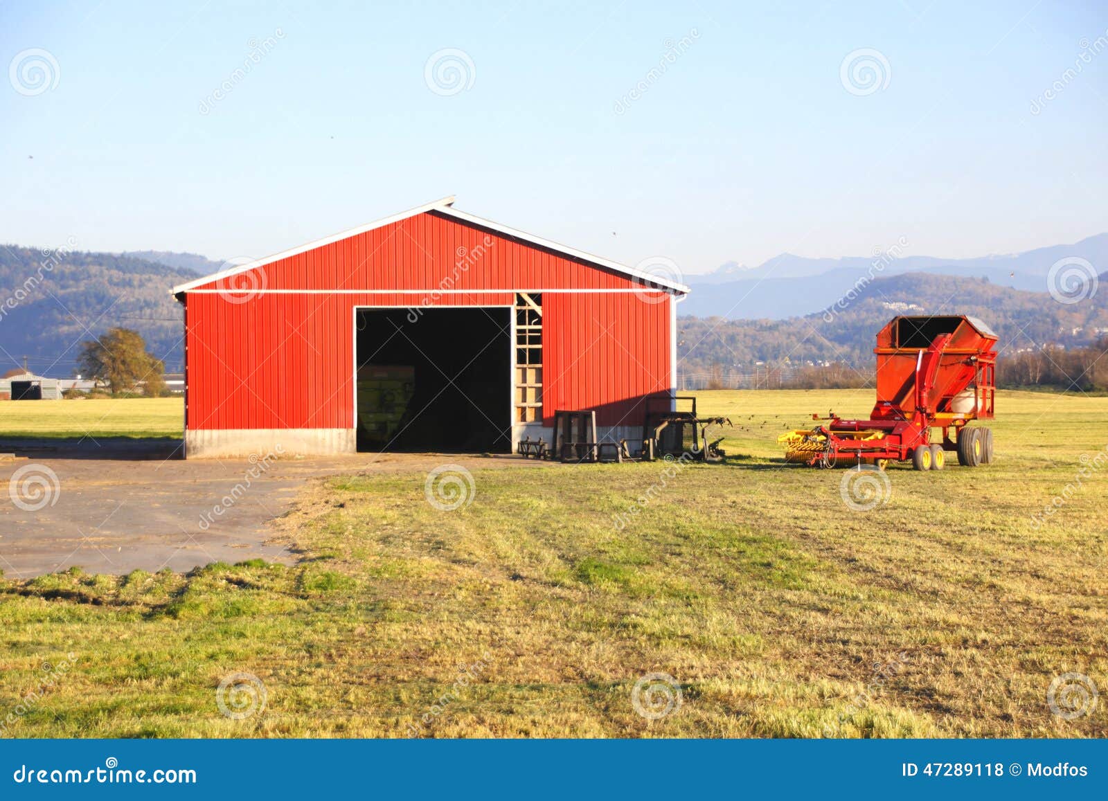 Small Barn and Hay Machine stock photo. Image of prefabricated - 47289118