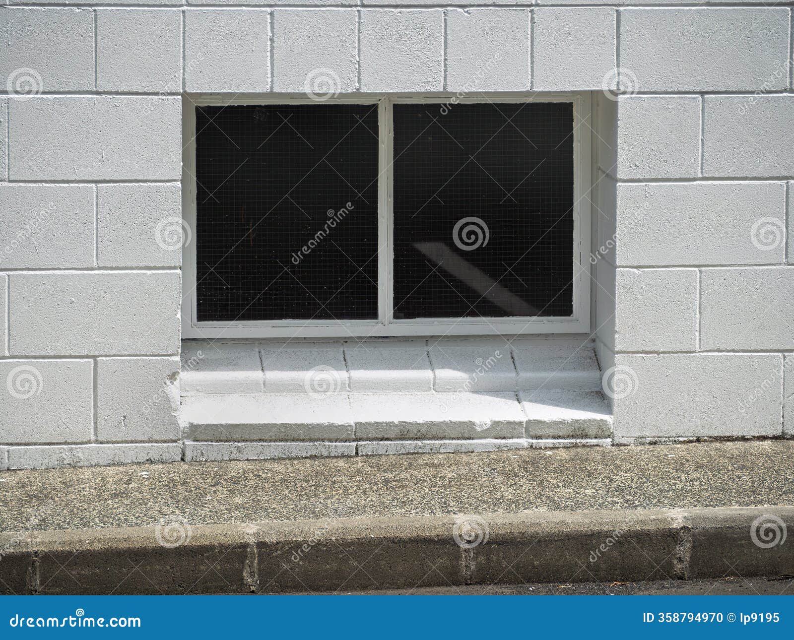 Small Basement Window with Security Mesh on White Brick Wall Stock ...