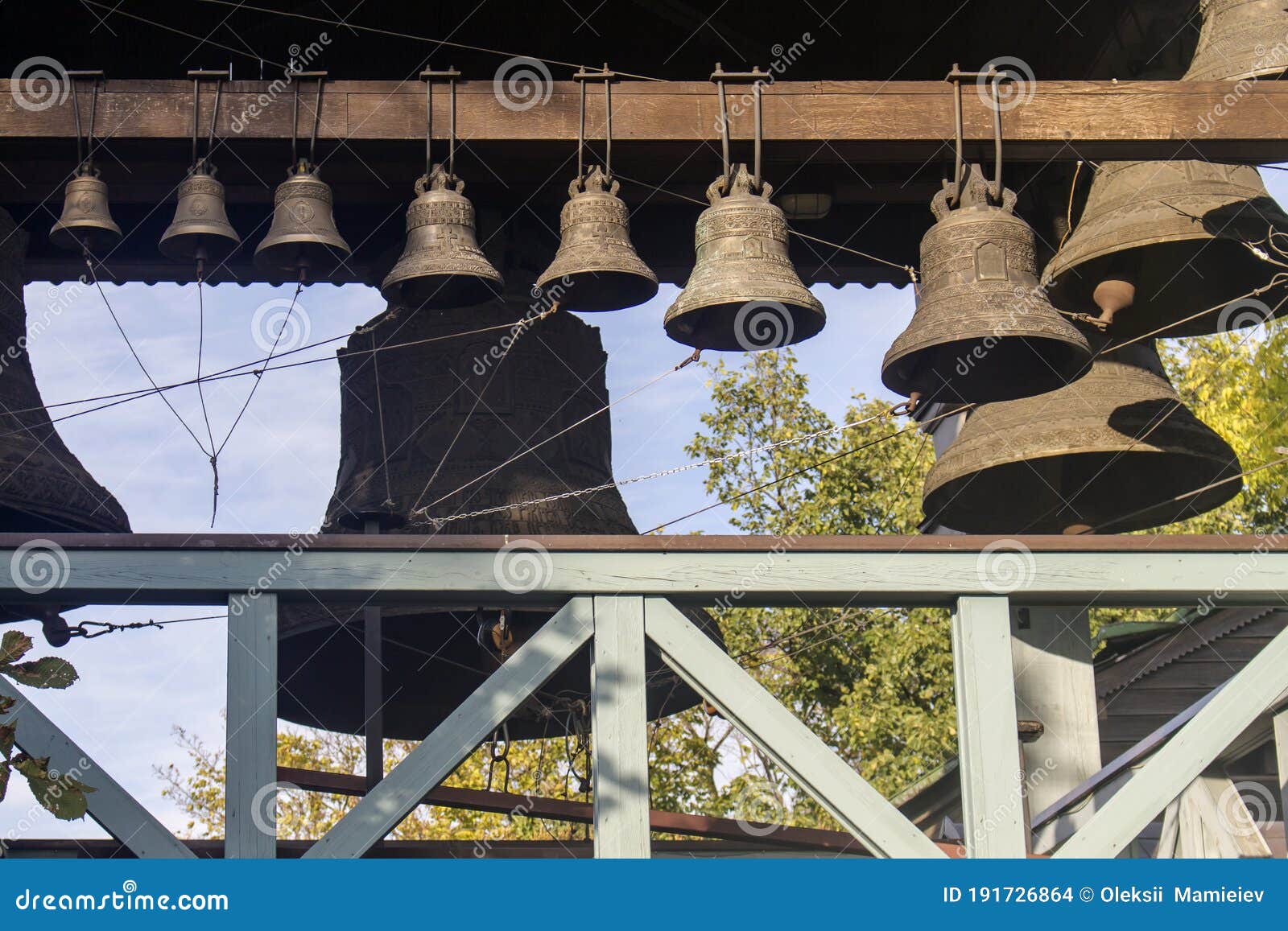 Small Bells with Patterns, Suspended in a Row in Ascending Order in ...