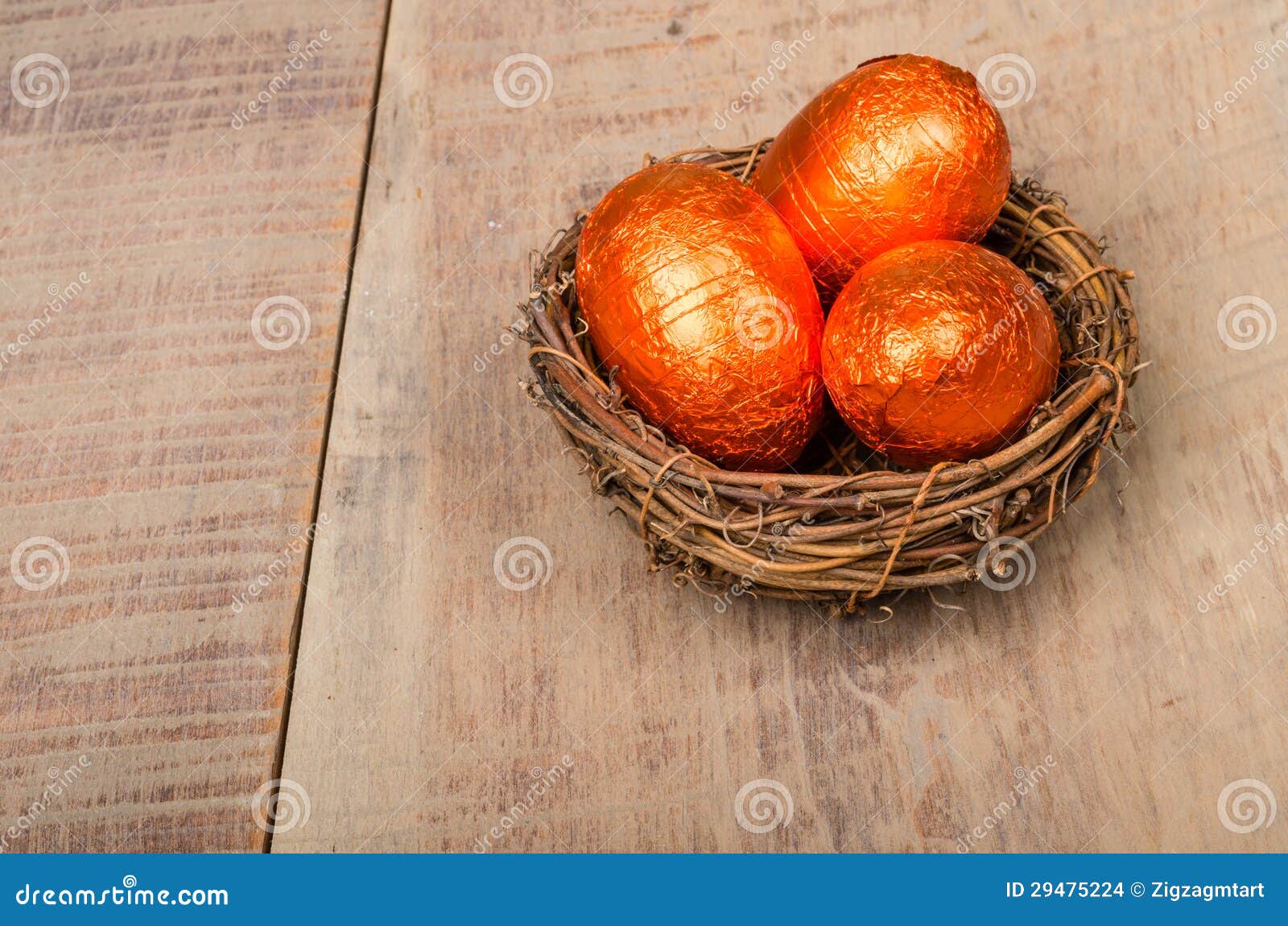 Small Bird S Nest with Orange Foil Eggs Stock Photo - Image of spring ...