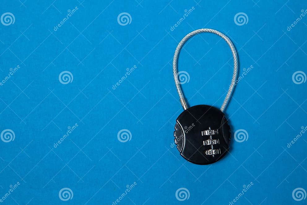 Small Black Iron Cipher Lock with a Coded Set on Blue Background Stock ...