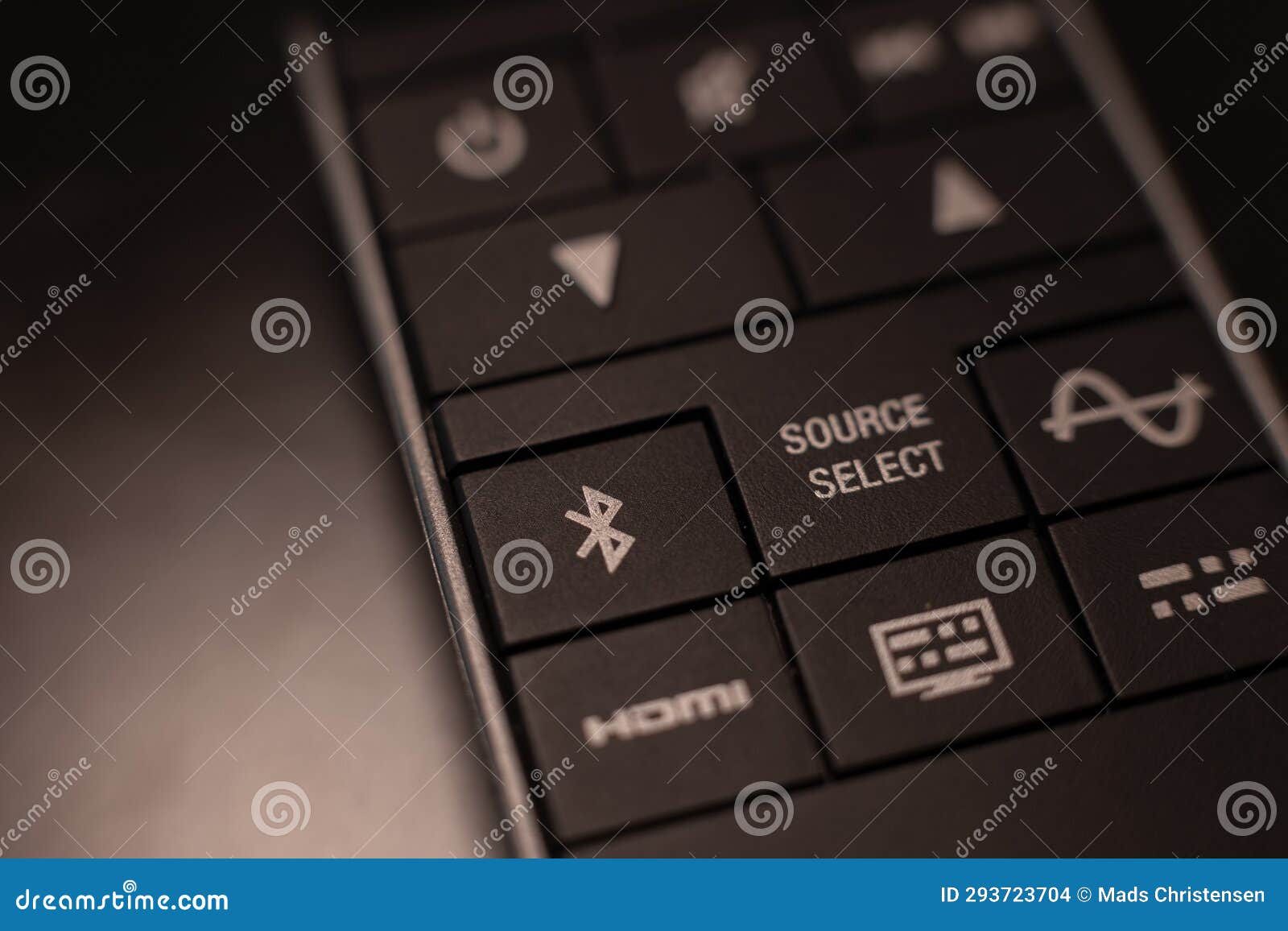 Small Black Remote with Focus on the Bluetooth and Source Select ...