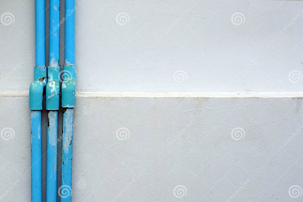 A Small Blue Plastic Pipe Installed on the Wall of the Building Stock ...