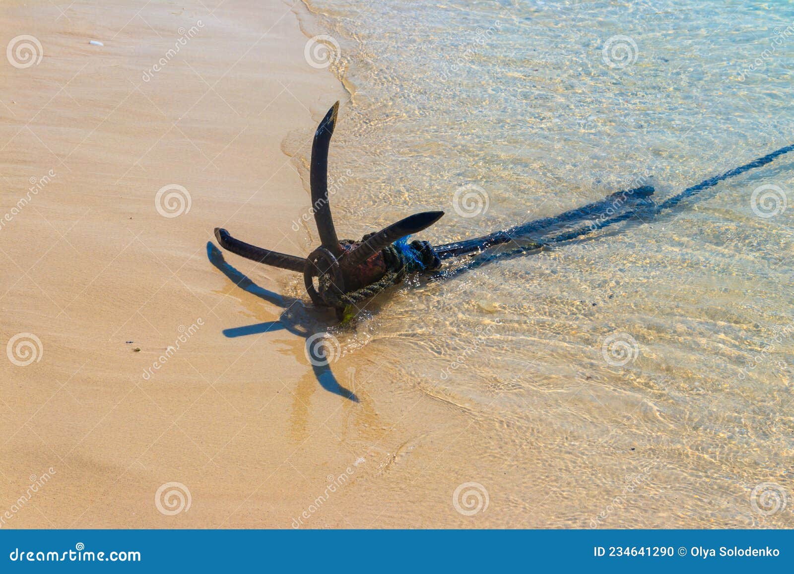 Small Boat Anchor on Shore of Ocean Stock Photo - Image of nautical ...