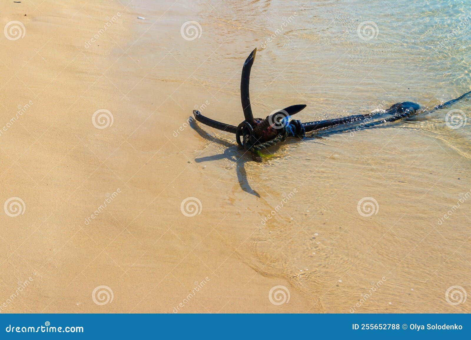 Small Boat Anchor on Shore of Ocean Stock Photo - Image of cord, calm ...