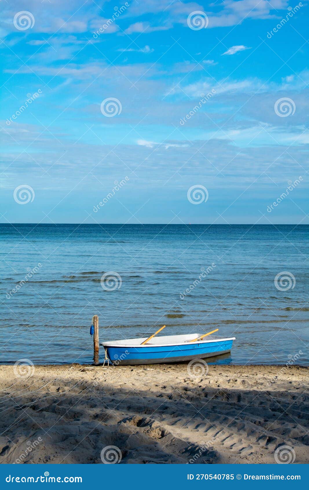 Small Boat on the Beach in Front of the Open Sea Stock Image - Image of ...