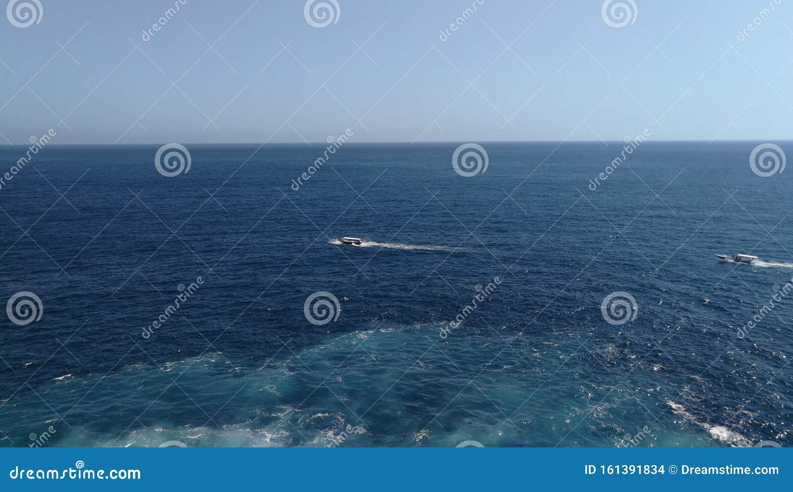 A Small Boat on Calm and Vast Sea Ocean Stock Photo - Image of blue ...
