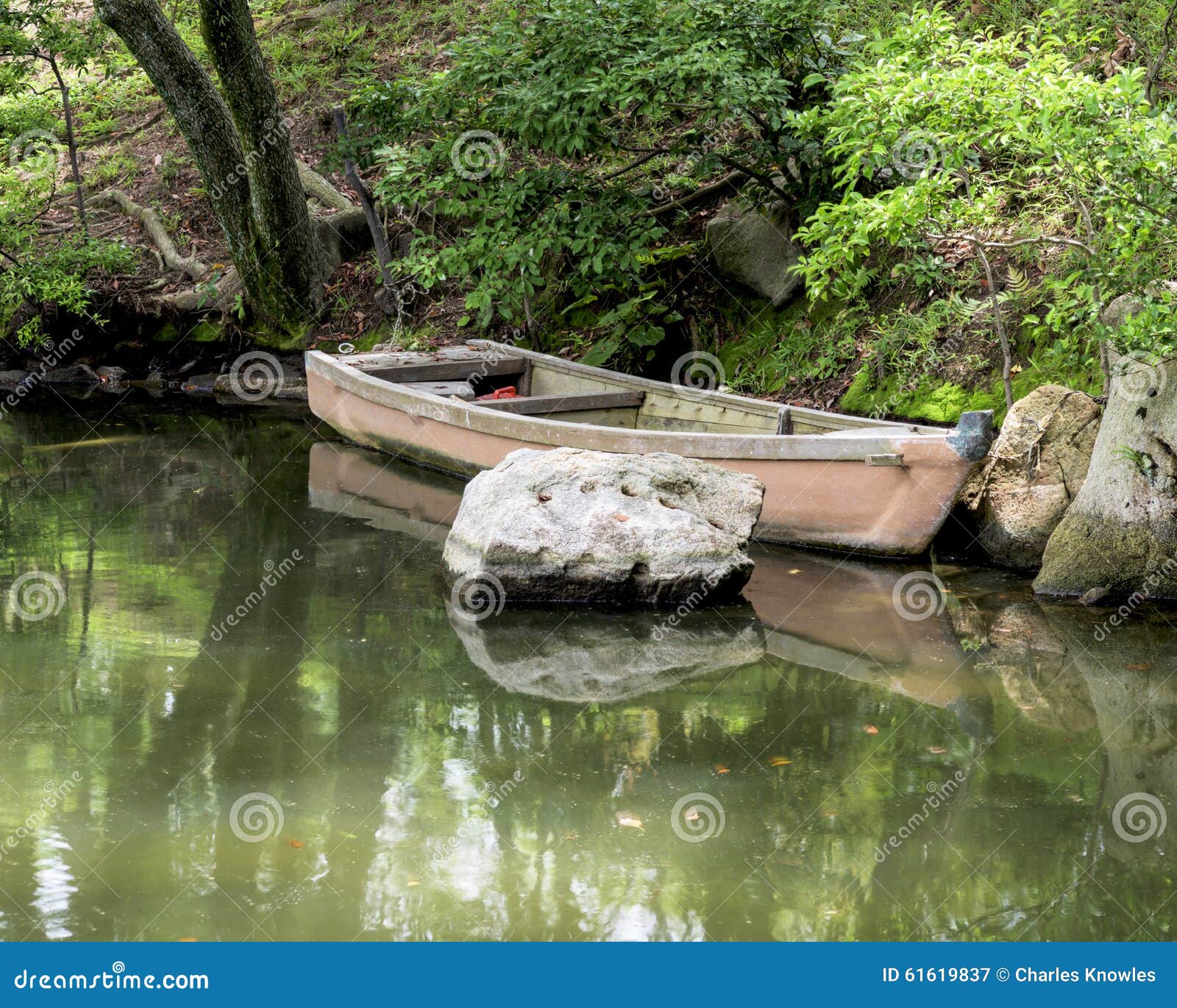 Small Boat Floating in a Green Pond of Water Stock Image - Image of ...
