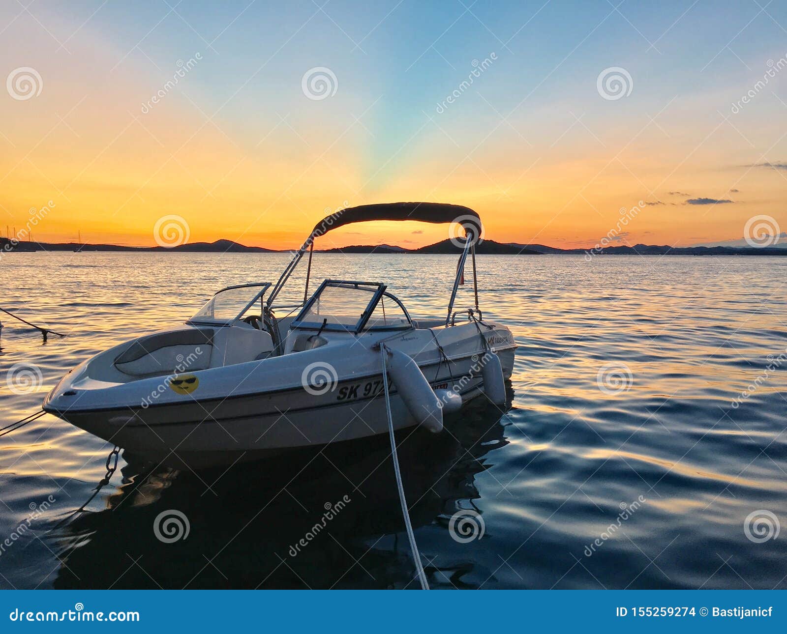 Small boat in the sunset editorial stock image. Image of small - 155259274