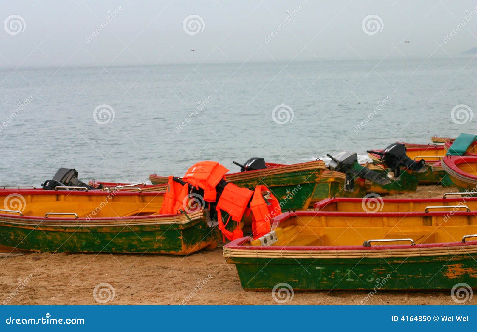 Small boats on beach stock photo. Image of water, boat - 4164850