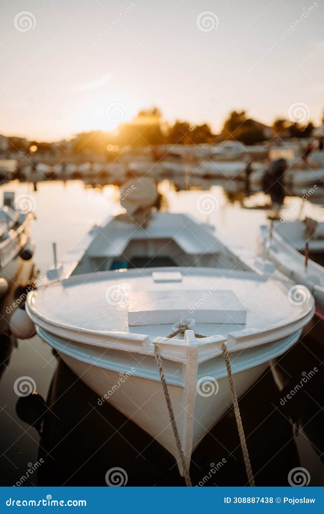 Small Boats on Calm Water, Moored in the Harbor during Sunset. Stock ...