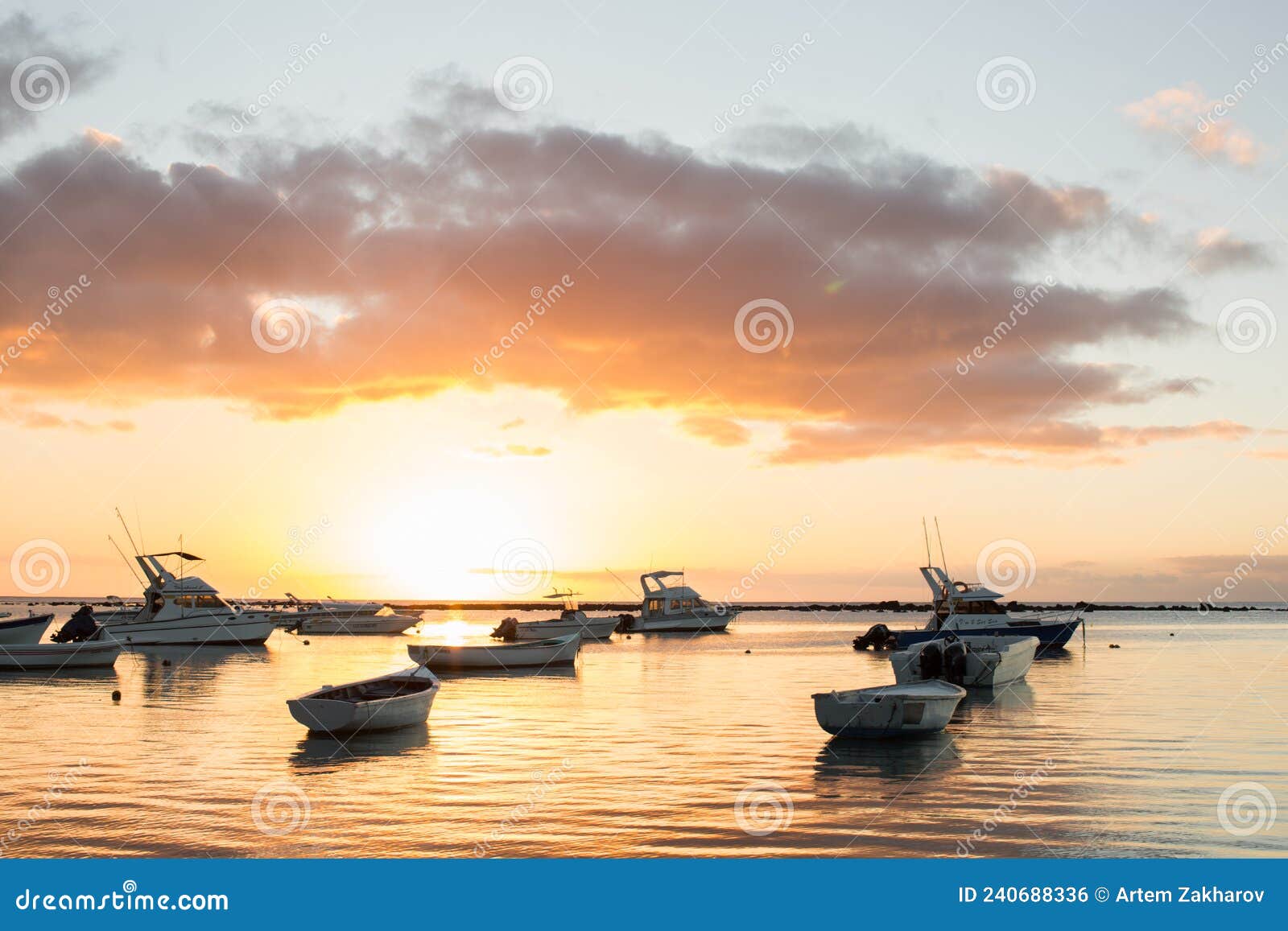 Small Boats in the Ocean at Sunset Stock Photo - Image of sunset ...