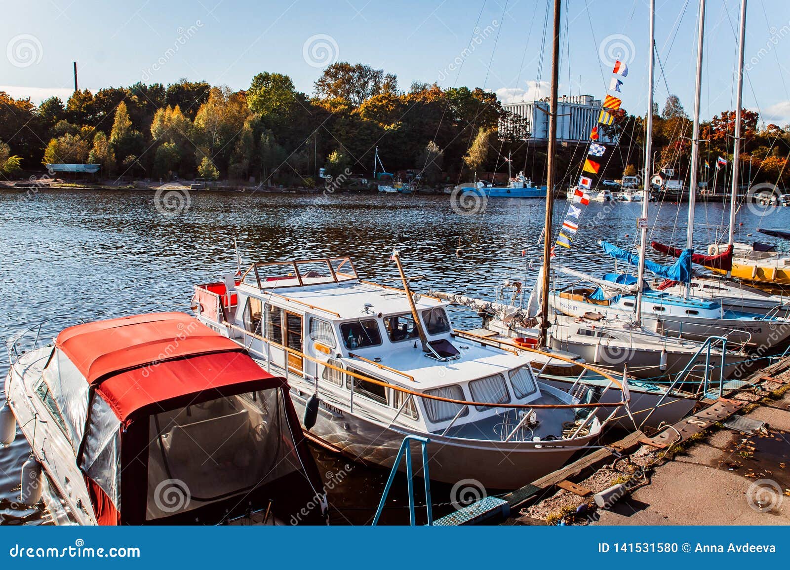 Small boats on the pier editorial image. Image of nautical - 141531580