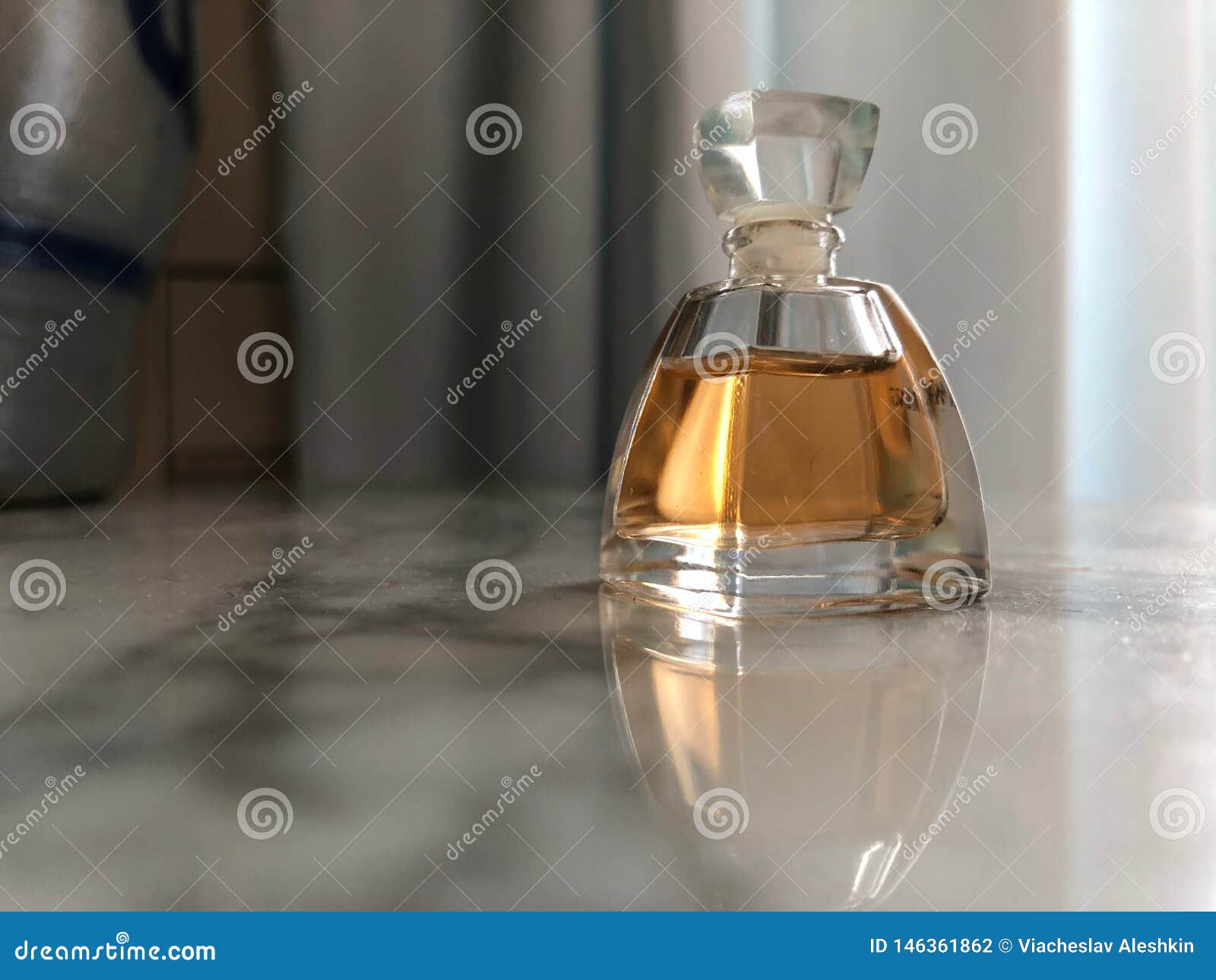 Small Bottle of Perfume in the Shape of a Pyramid 01 Stock Photo ...