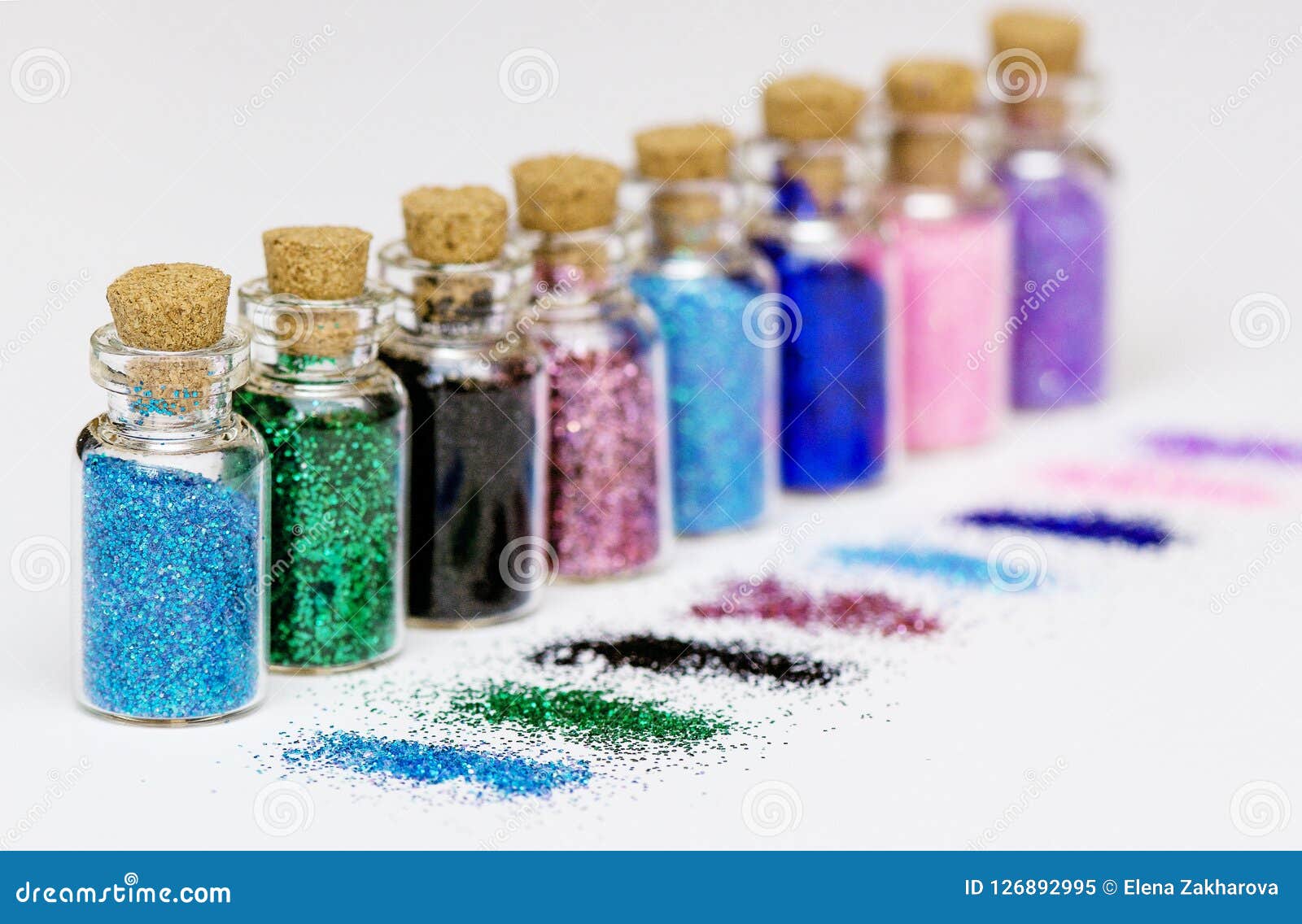 Small Bottles with Multicolored Sparkles and Scattered Spangles on ...